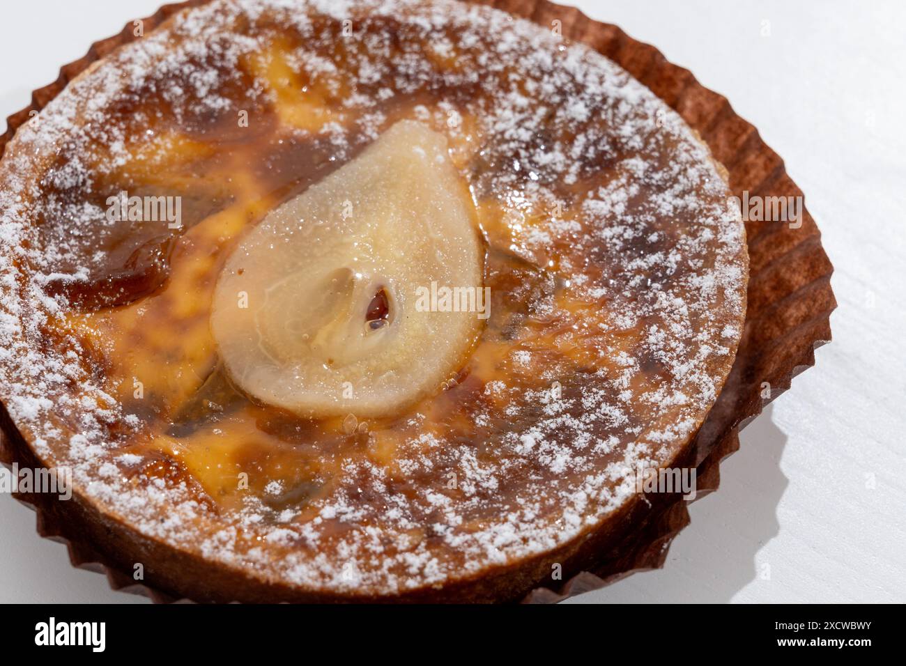 Homemade baked pear cake with caramel almond custard close up ...