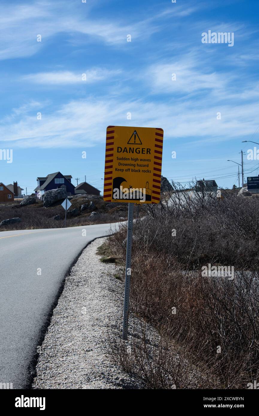 Warning sign danger rocks waves hi-res stock photography and images - Alamy