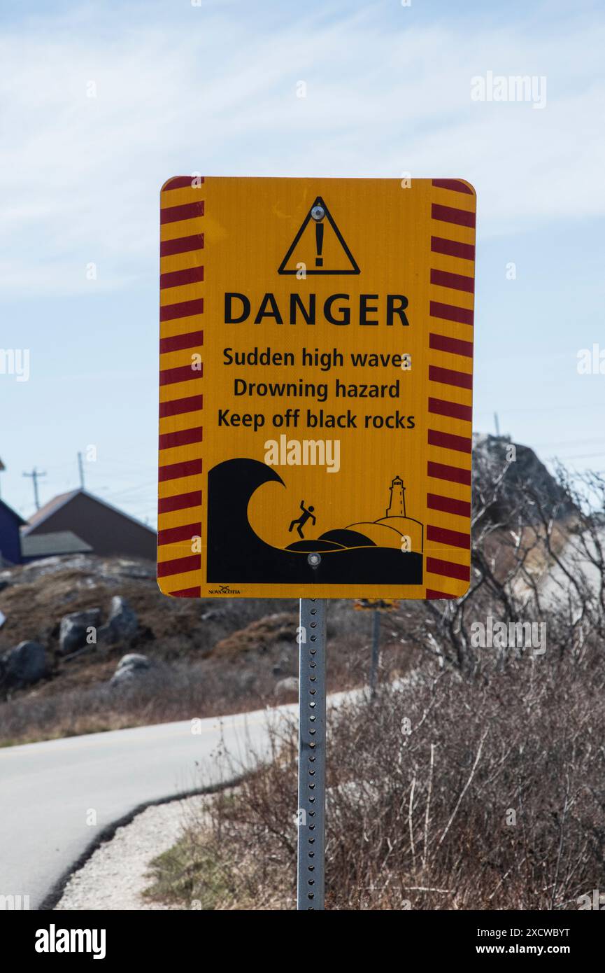 Warning sign danger rocks waves hi-res stock photography and images - Alamy