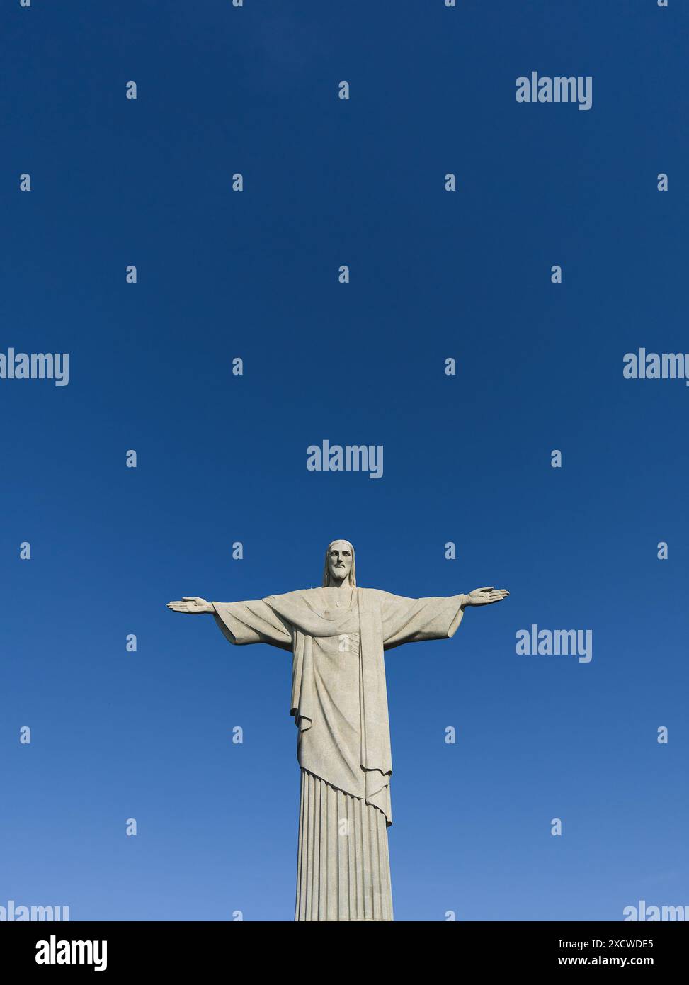 the majestic Christ the redeemer statue stands tall against a clear ...