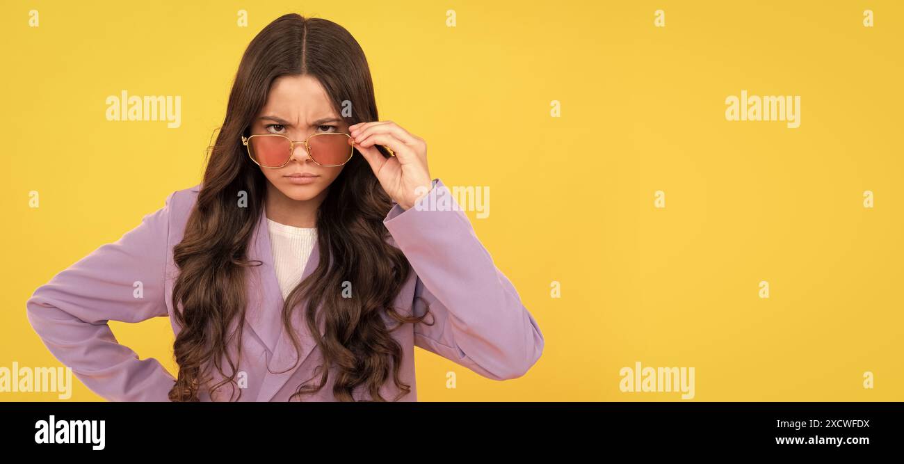 keep under control. serious kid with curly hair in sunglasses. beauty ...