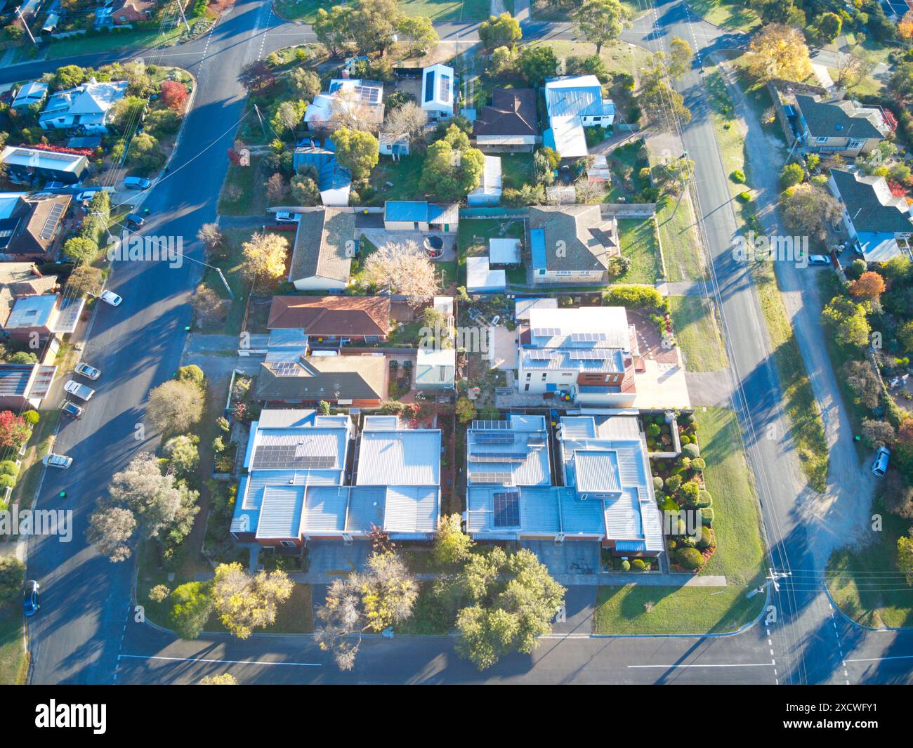 Residential street showing suburban houses from above, green trees ...