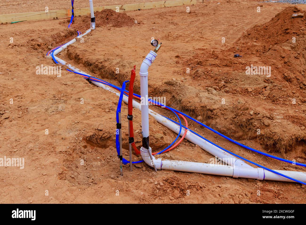 Placing underground water pipes sanitary pipes in preparation for ...
