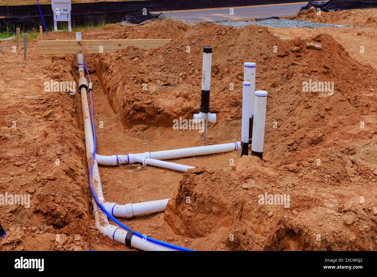 Laying underground water pipes sanitary pipes prior to pouring concrete ...