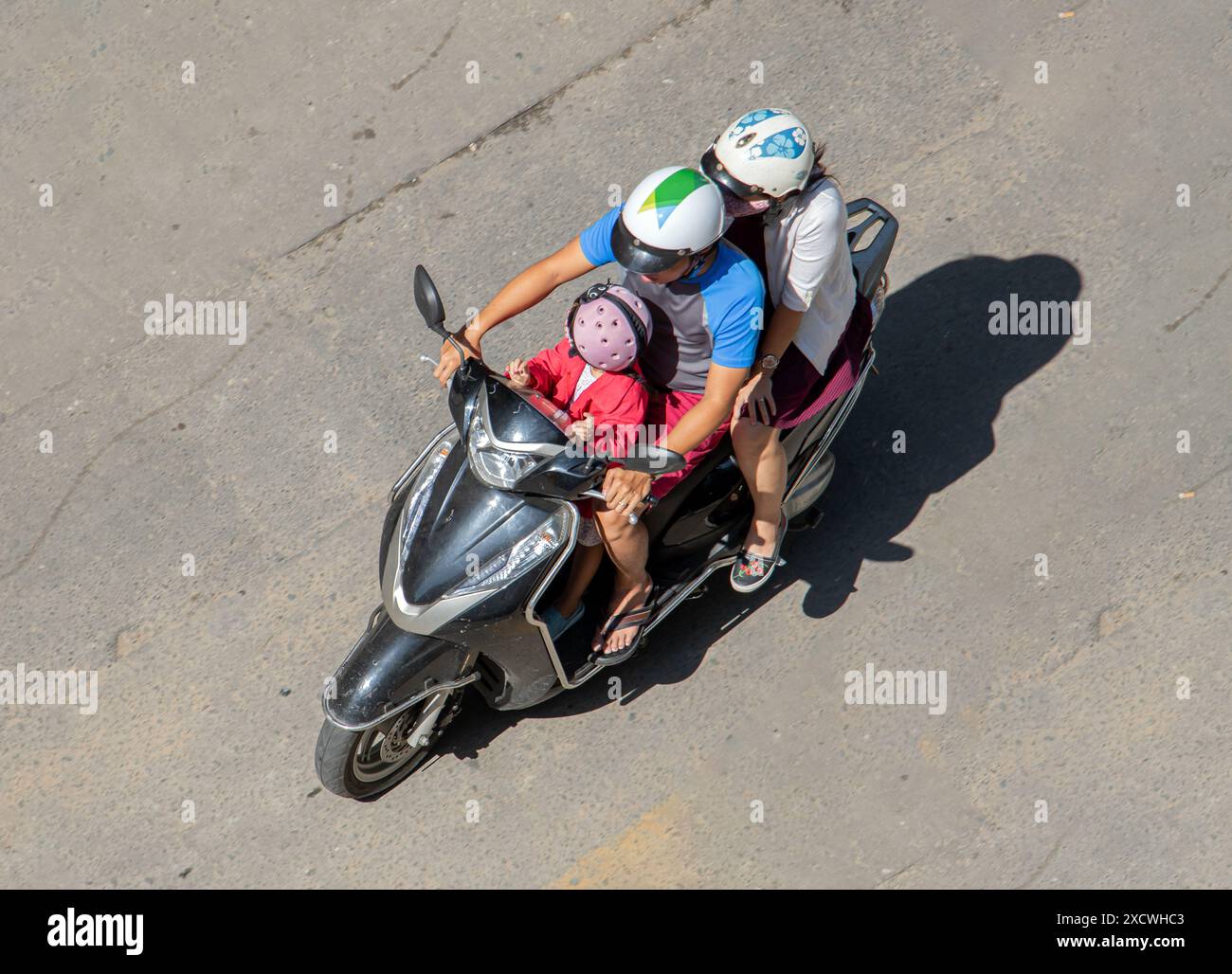 A family rides a motorcycle together, Saigon city, Vietnam Stock Photo ...