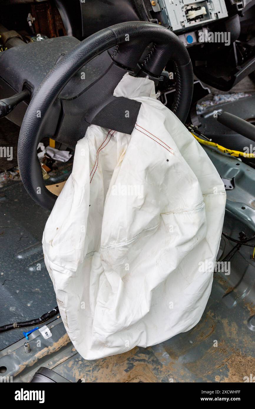 The deployed airbag in the steering wheel of a wrecked car Stock Photo ...