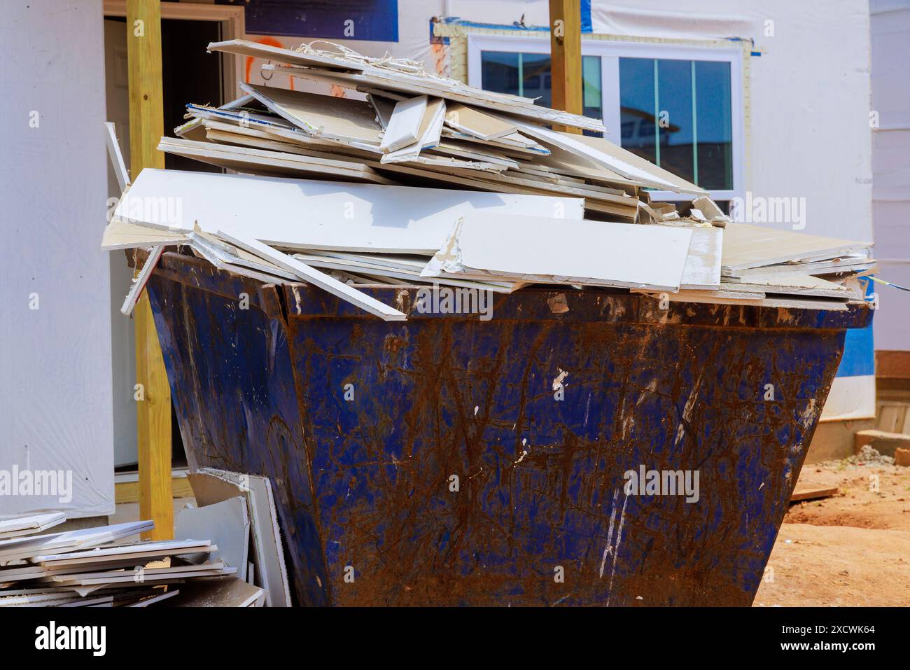 Container with construction waste was emptied of remaining plasterboard ...