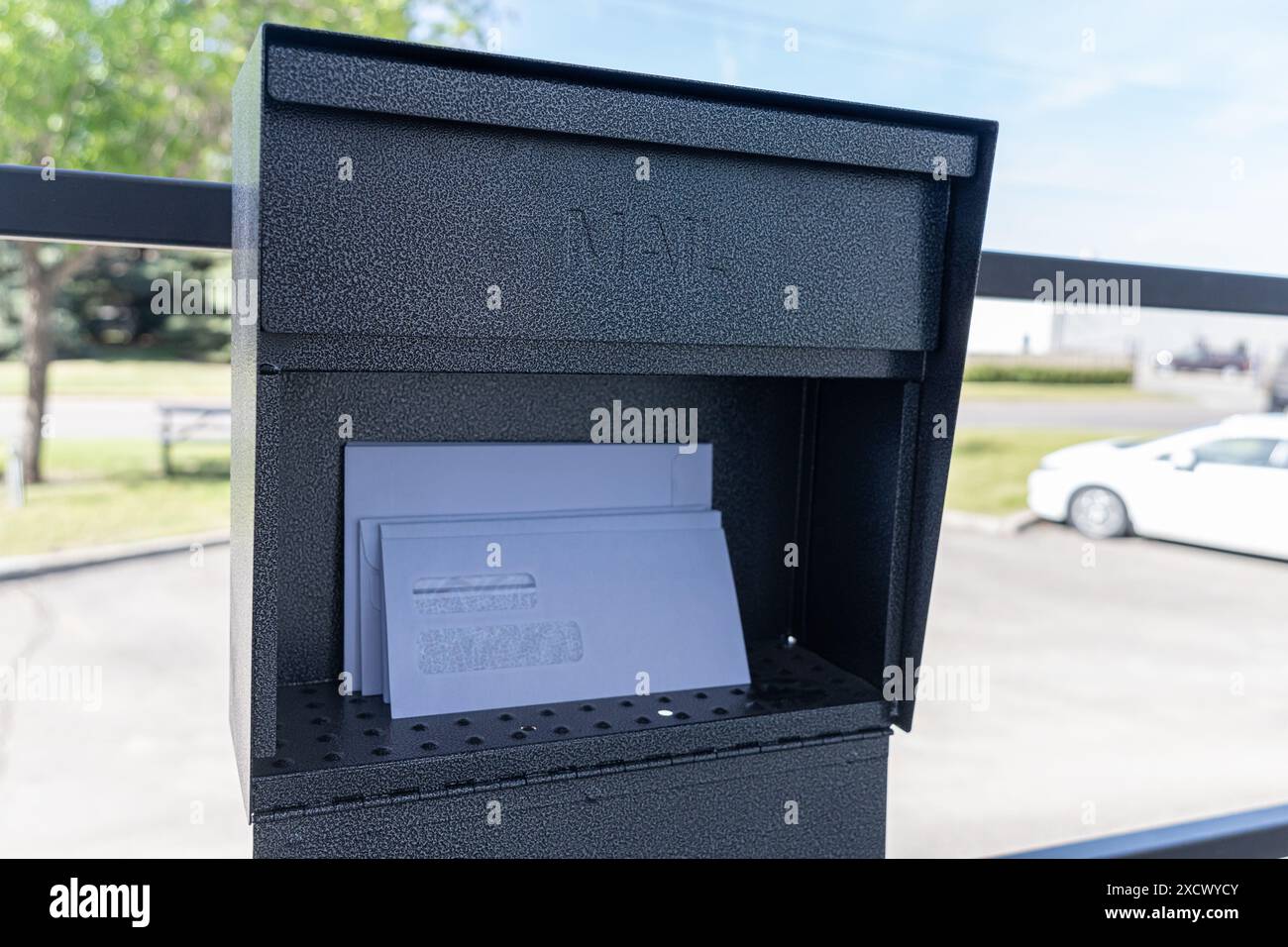 mailbox with letters and packages received Stock Photo - Alamy