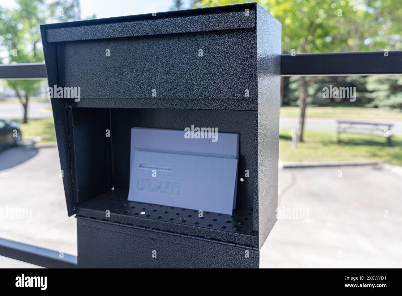 mailbox with letters and packages received Stock Photo - Alamy
