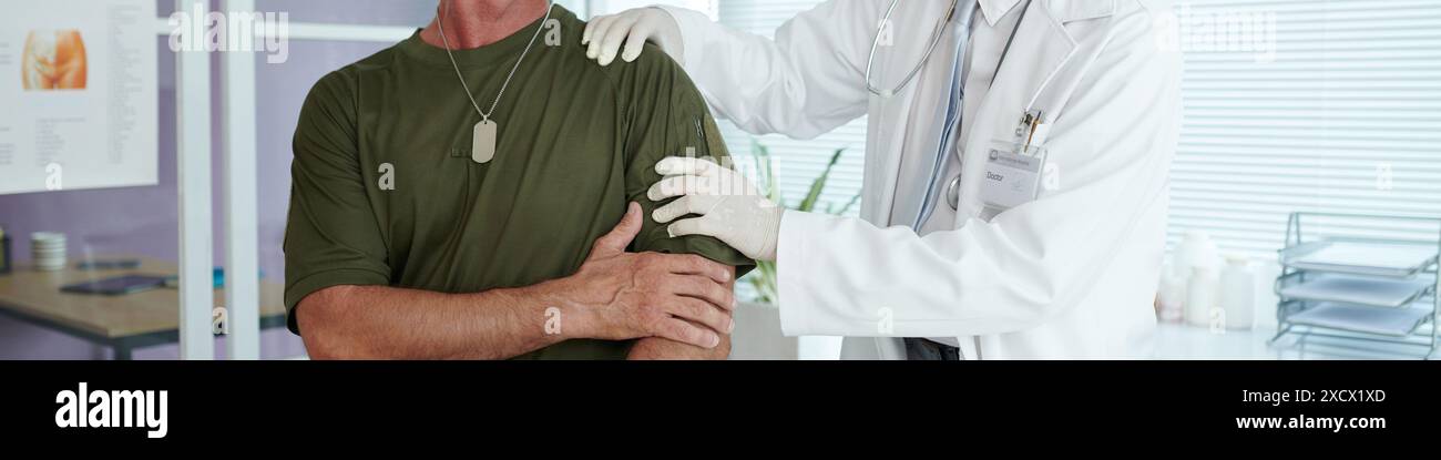 Doctor Examining Injured Arm In Hospital Stock Photo - Alamy
