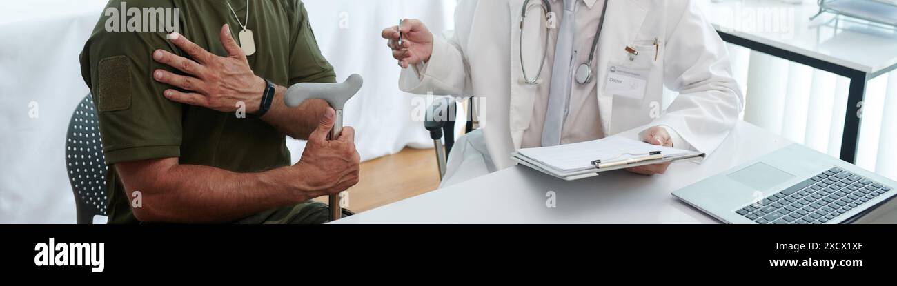 Soldier Having Consultation With Doctor Stock Photo - Alamy