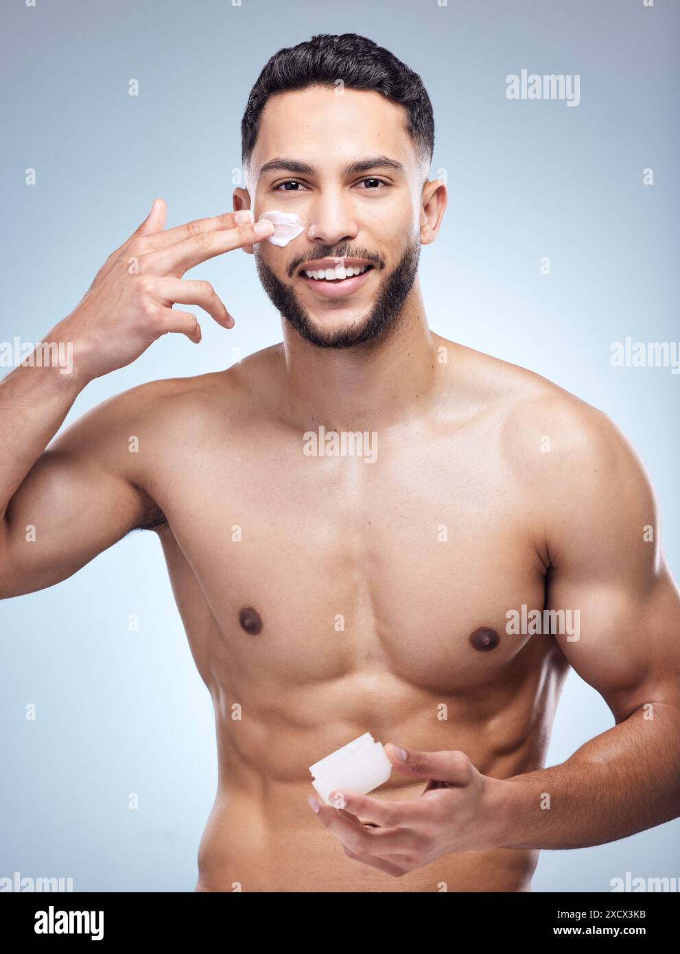 Skincare, portrait and man in studio with cream for cosmetics, natural ...