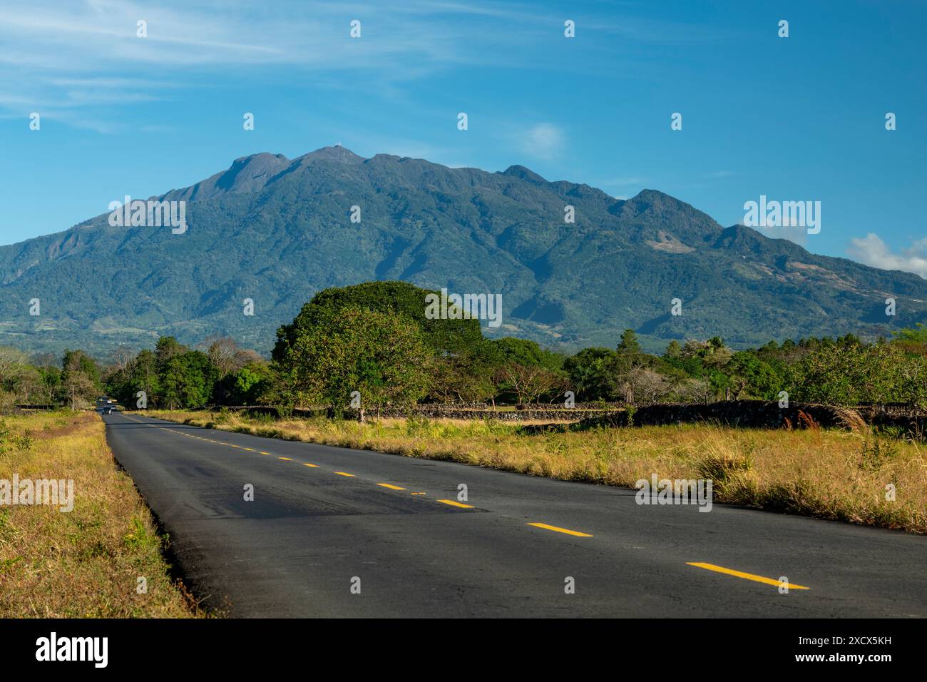 Outdoor asphalt road in Chiriqui province with Baru volcano in the ...