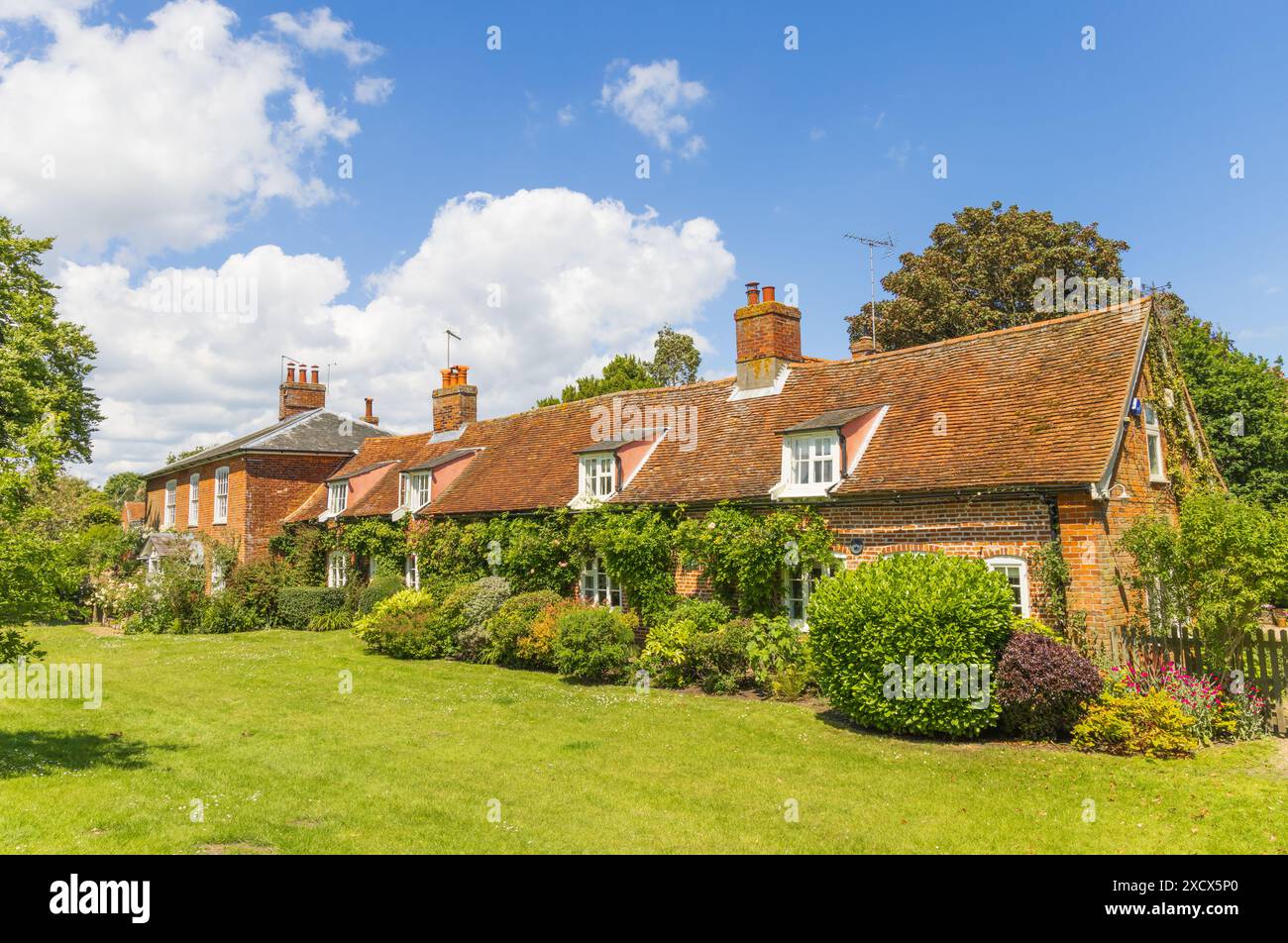 Row of old traditional terraced English village cottages on a sunny day ...