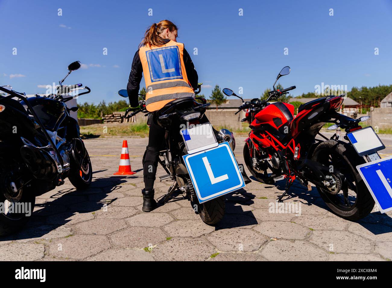 Learning to ride a motorcycle Stock Photo - Alamy