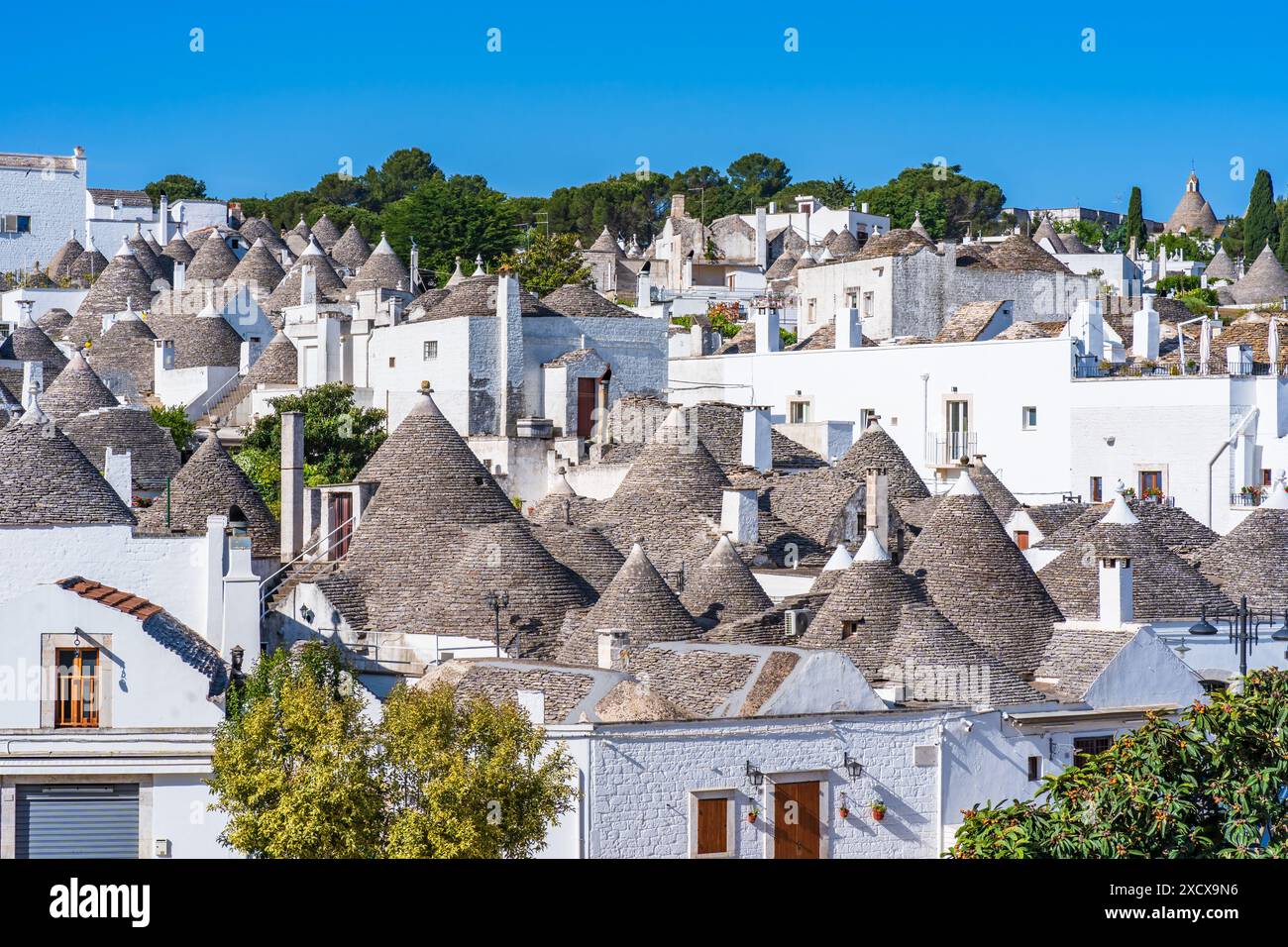 View of Alberobello and conical roofs of the famous old dry stone ...