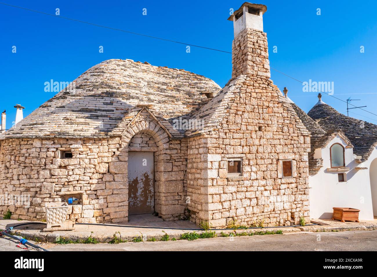 Famous traditional old dry stone trulli houses with conical roofs in ...
