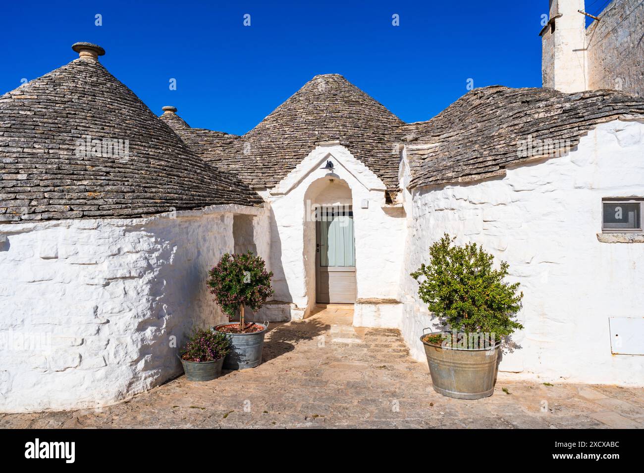 Famous traditional old dry stone trulli houses with conical roofs in ...