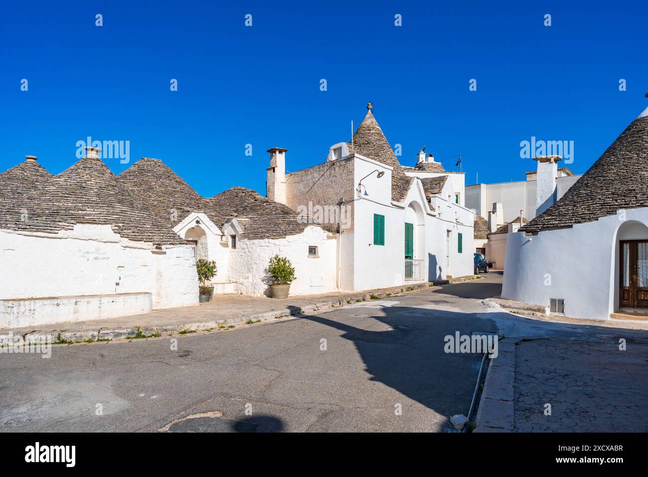 Famous traditional old dry stone trulli houses with conical roofs in ...