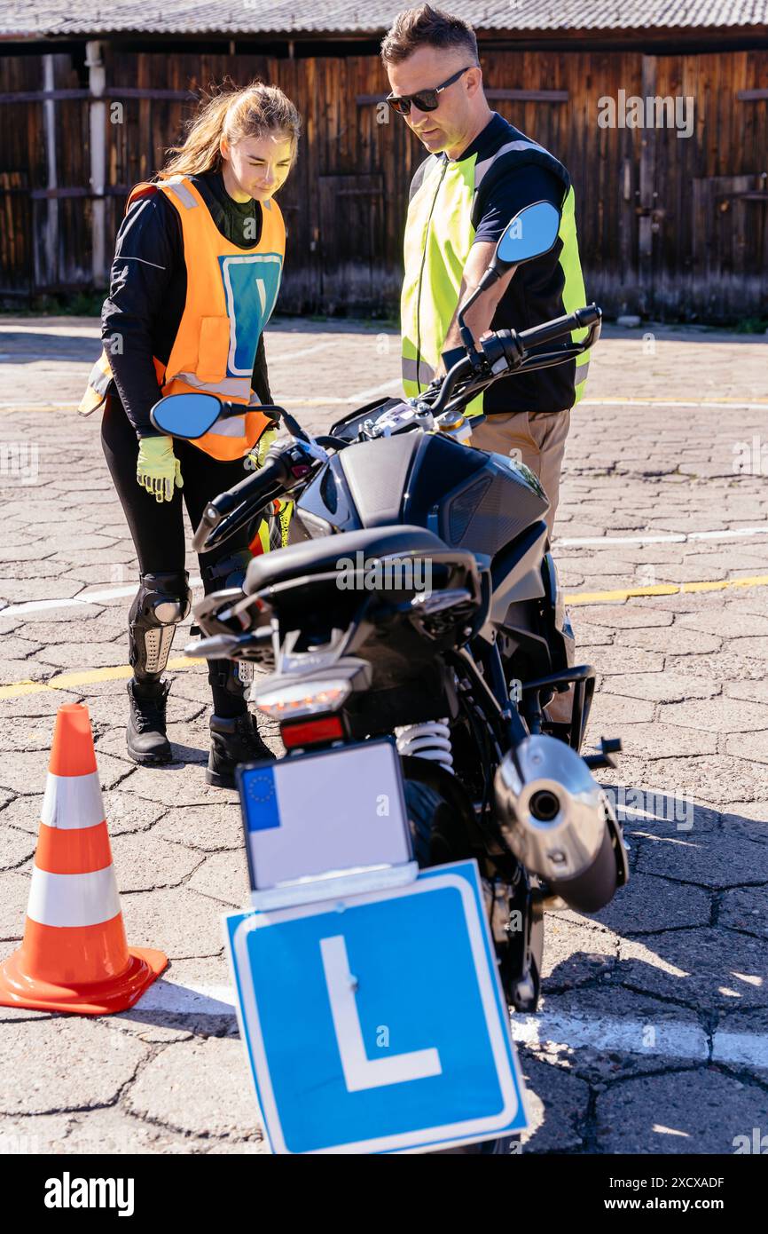 Motorcycle driving practice. Learner motorcyclist practicing to ride a ...
