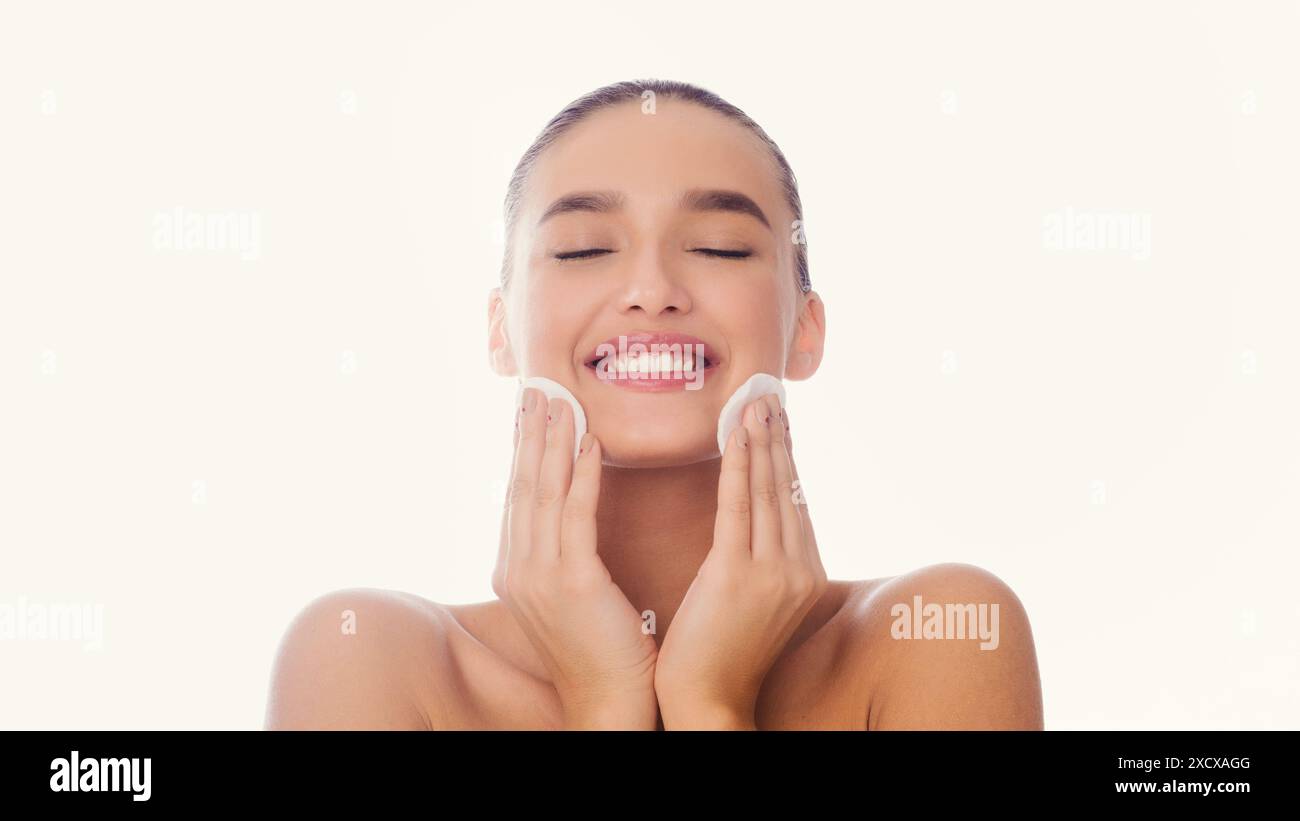 Happy Woman Washing Face With Facial Cleanser Stock Photo - Alamy