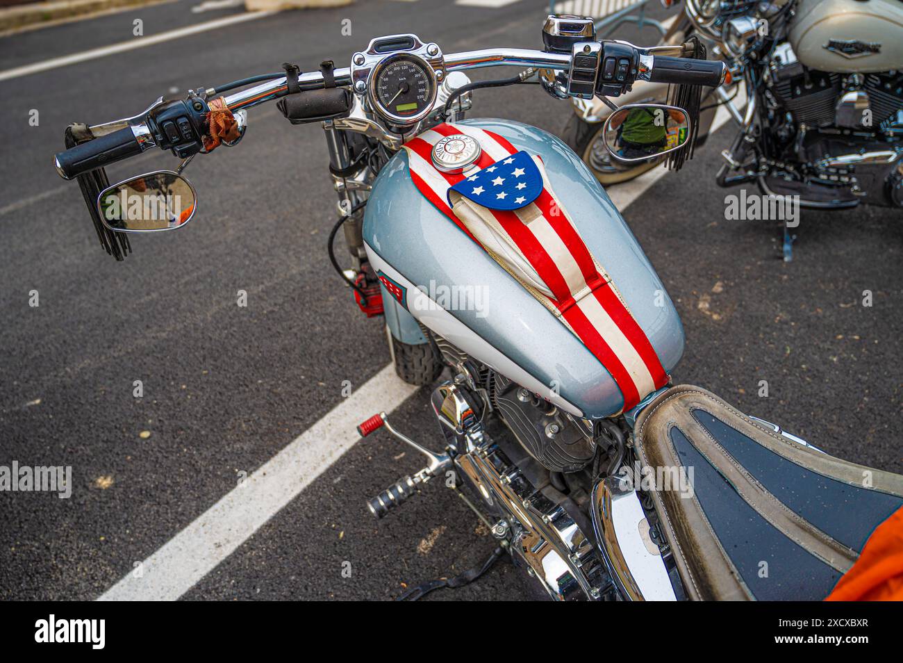 A close-up of a custom motorcycle with an American flag design Stock ...