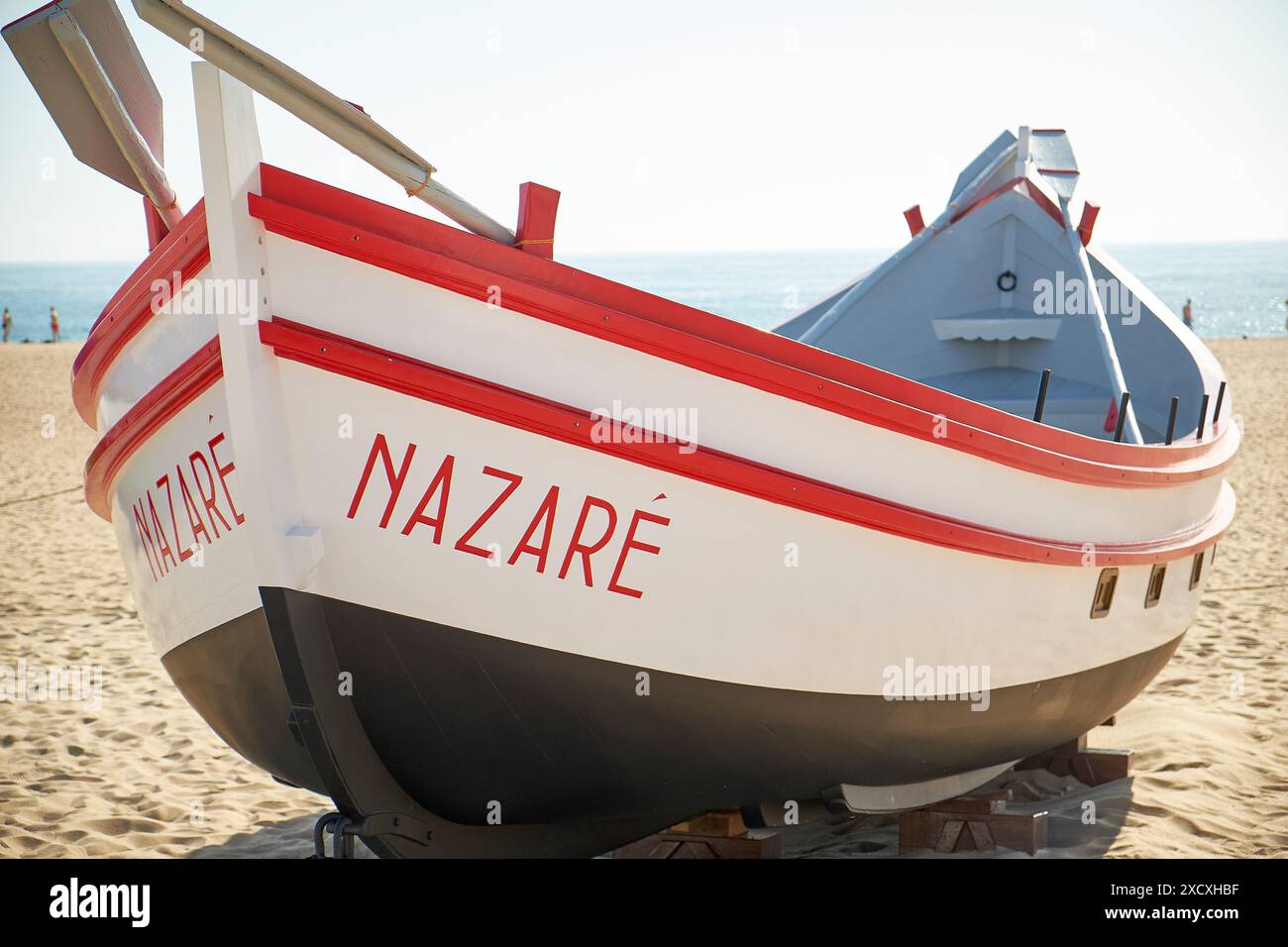 Fishing boats on the beach at Nazare, Portugal Stock Photo - Alamy