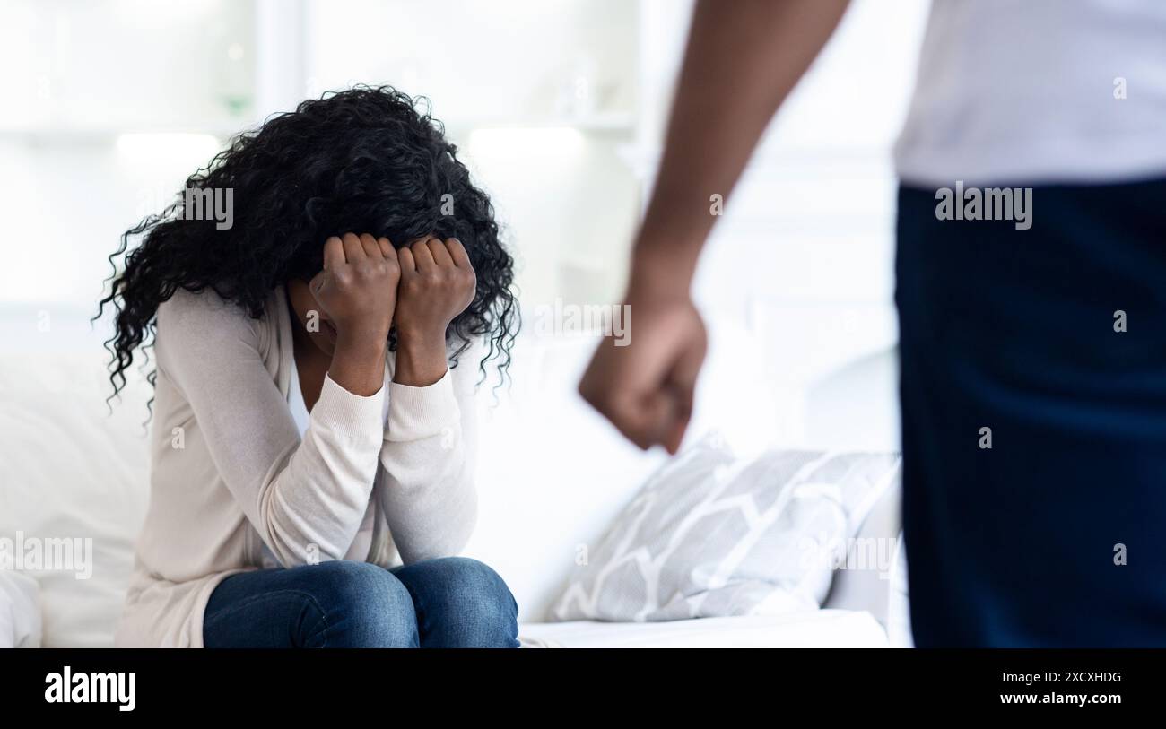 Woman Crying While Man Stands Behind Her Stock Photo - Alamy