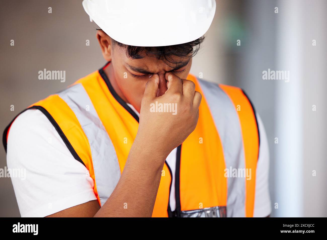 Construction site, man and contractor with headache of stress, burnout ...