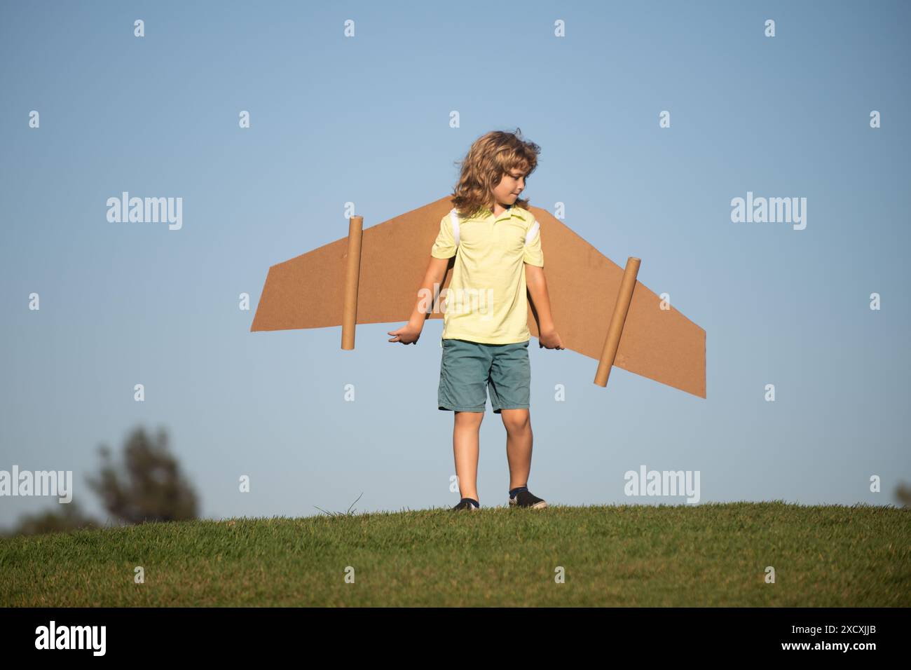Child boy plays pilot astronaut. Kid dreaming of becoming a aviator ...