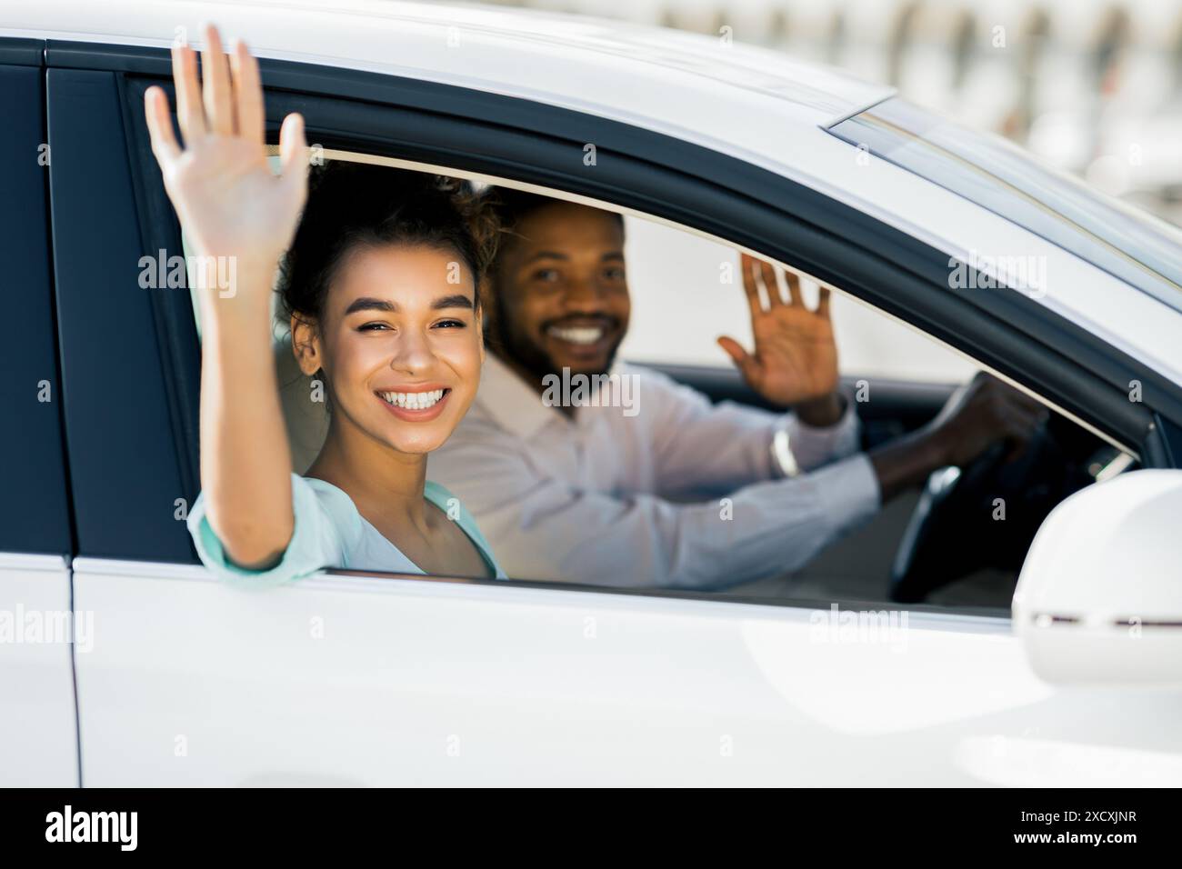 Man waving from auto hi-res stock photography and images - Alamy