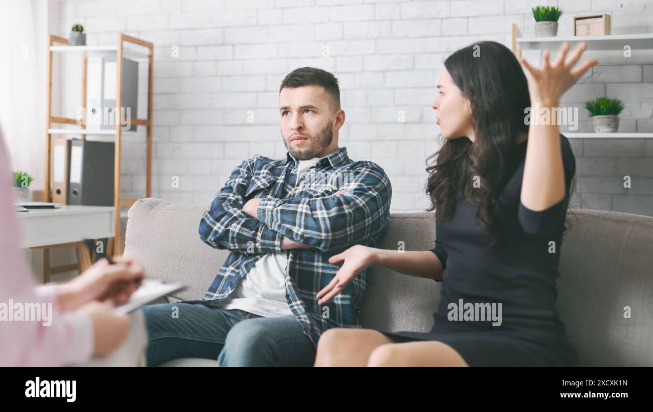 Couple Arguing During Couples Therapy Session In Modern Office Stock ...