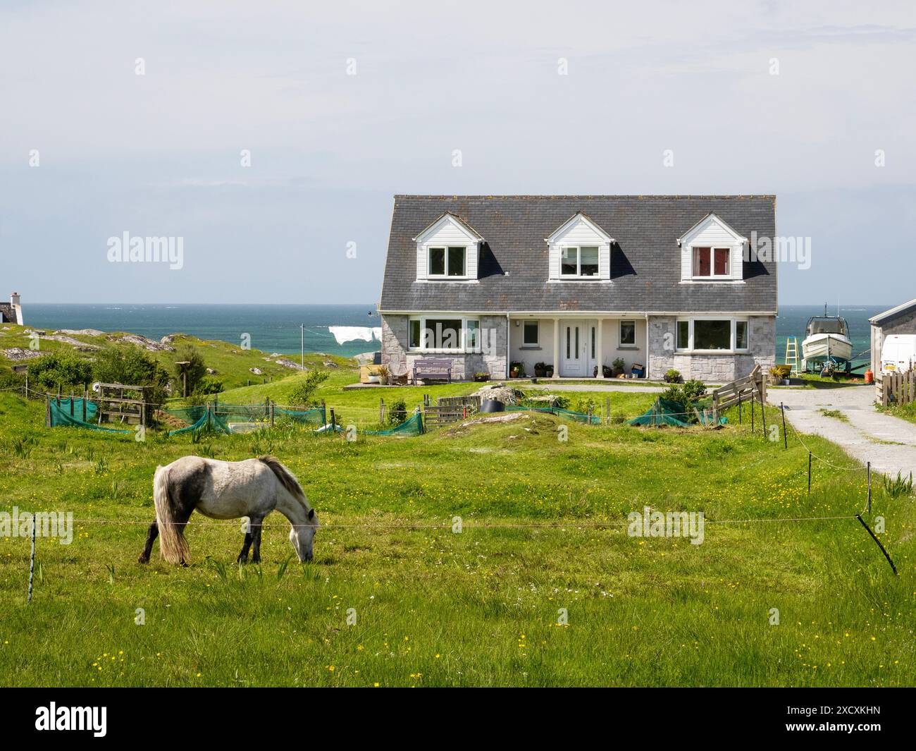A house at Rubha Ban on Eriskay, Outer Hebrides, Scotland, UK Stock ...