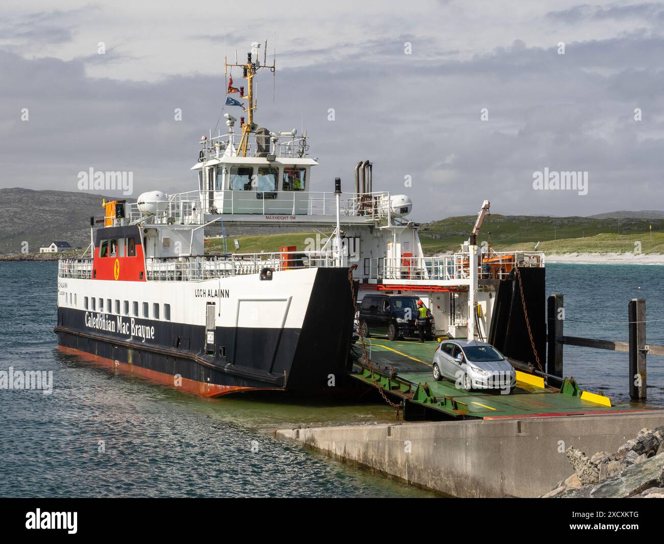A car disembarking the ferry onto Eriskay from the Isle of Barra, Outer ...