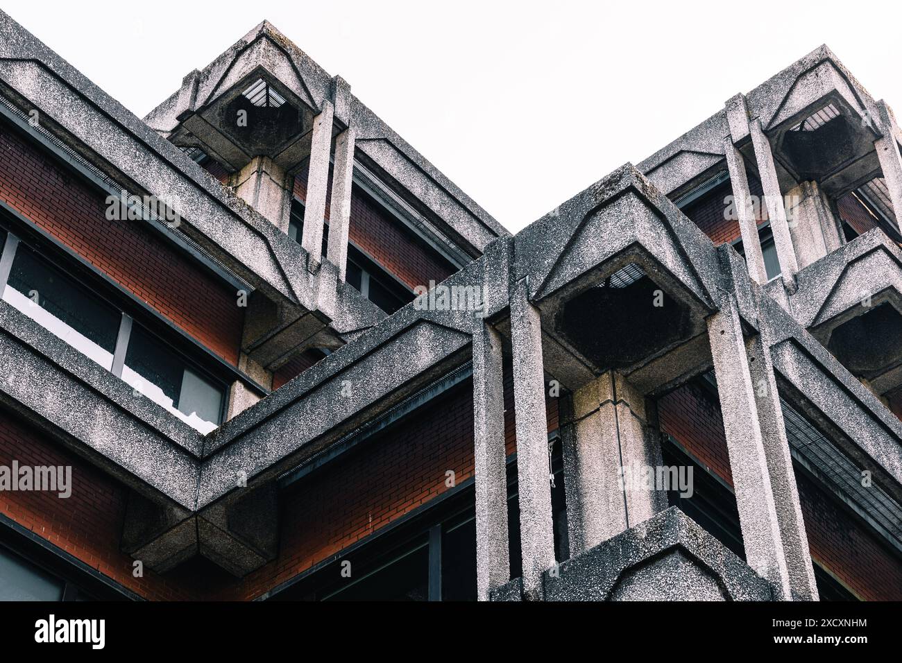 A Close-up of a brutalist architecture building with concrete and brick ...