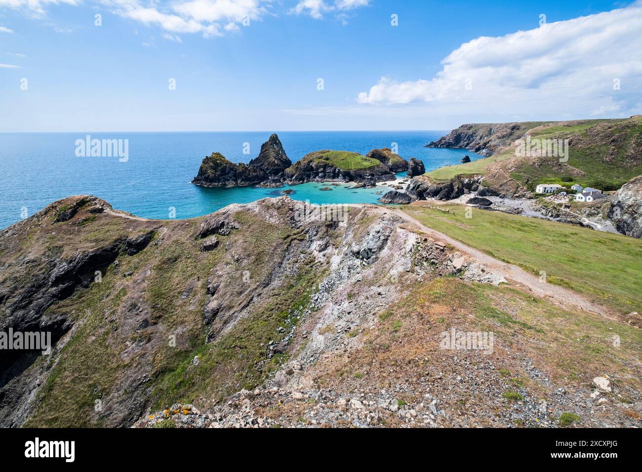The rugged Kynance Cove, Cornwall, England with the blue ocean on a ...