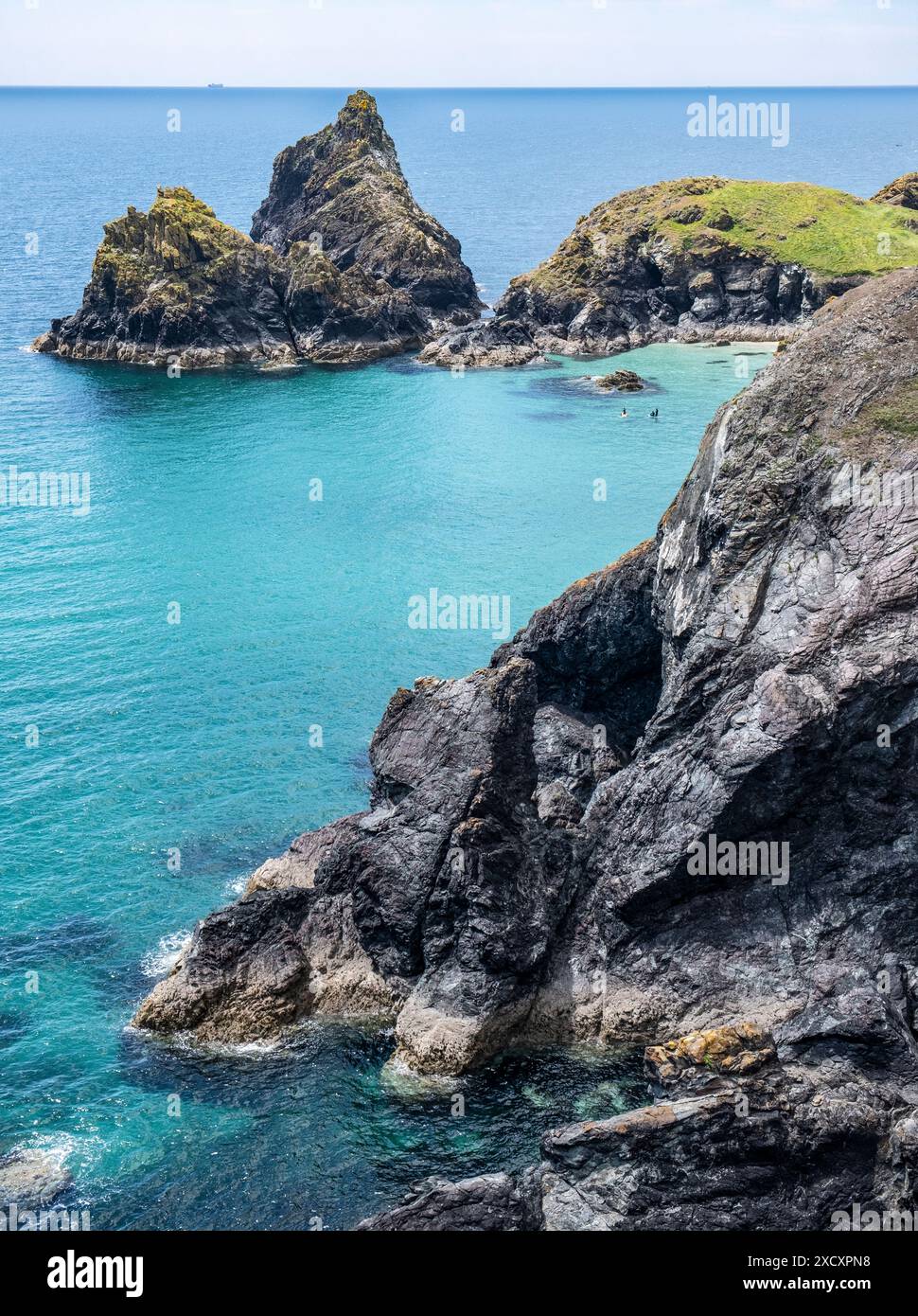The rugged Kynance Cove, Cornwall, England with the blue ocean on a ...