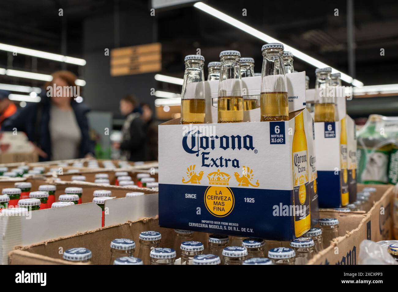 Corona Extra Beer sale, in beer boxes for 6 bottles, with handle. Pile ...