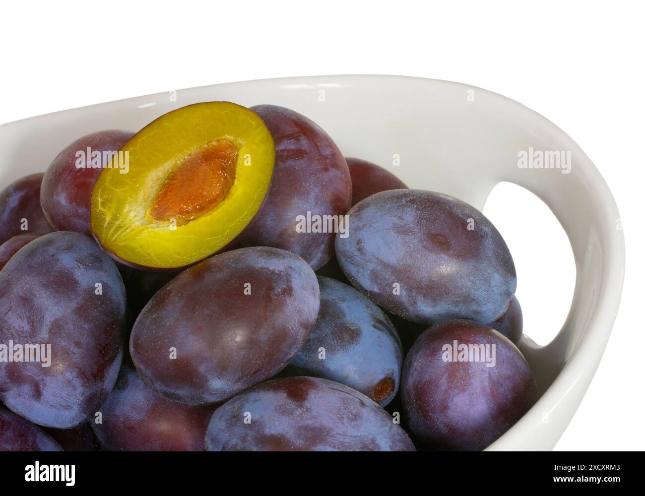 Fresh plums in bowl, cutout, white background Stock Photo - Alamy
