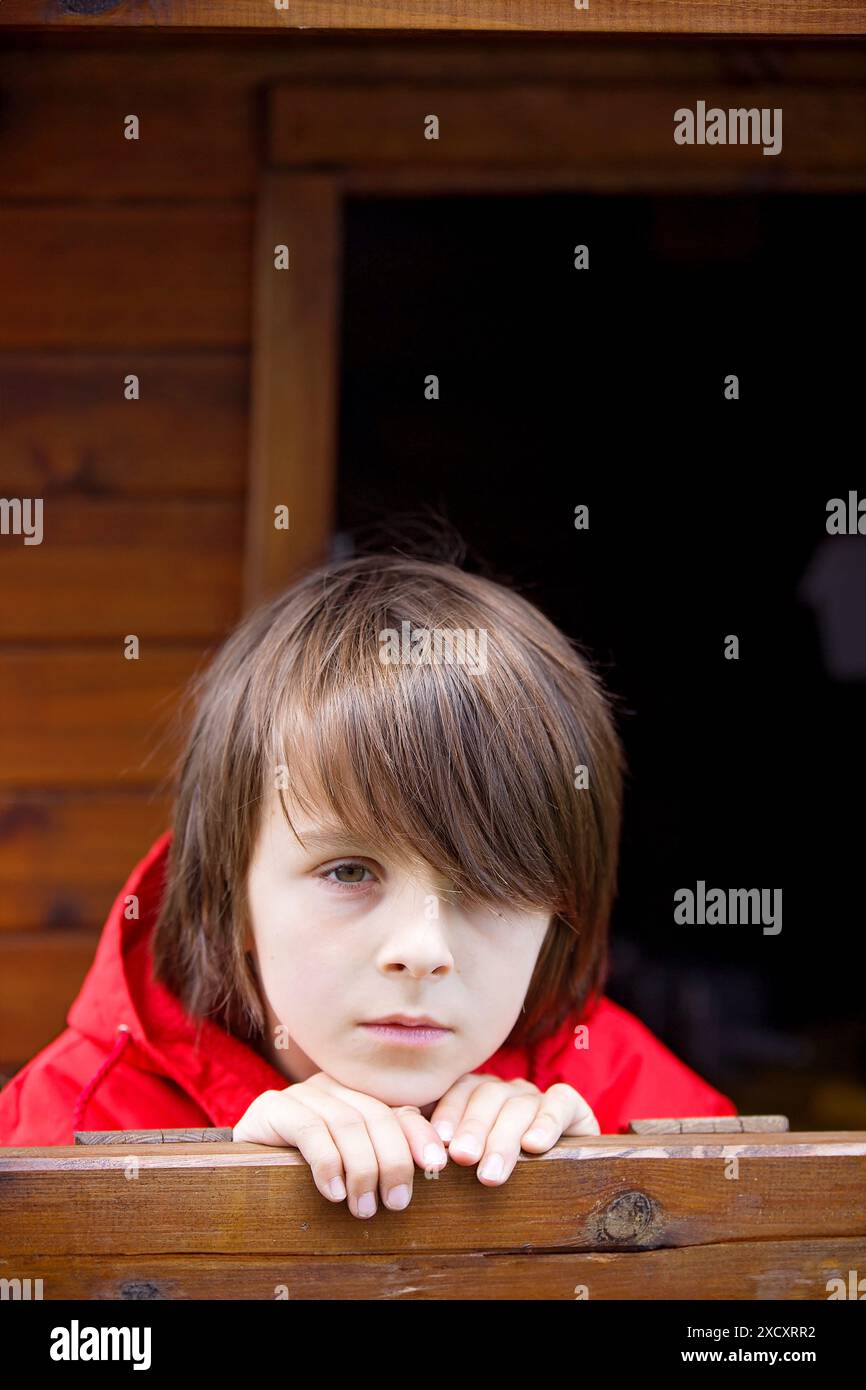 Child boy hiding in wardrobe hi-res stock photography and images - Alamy