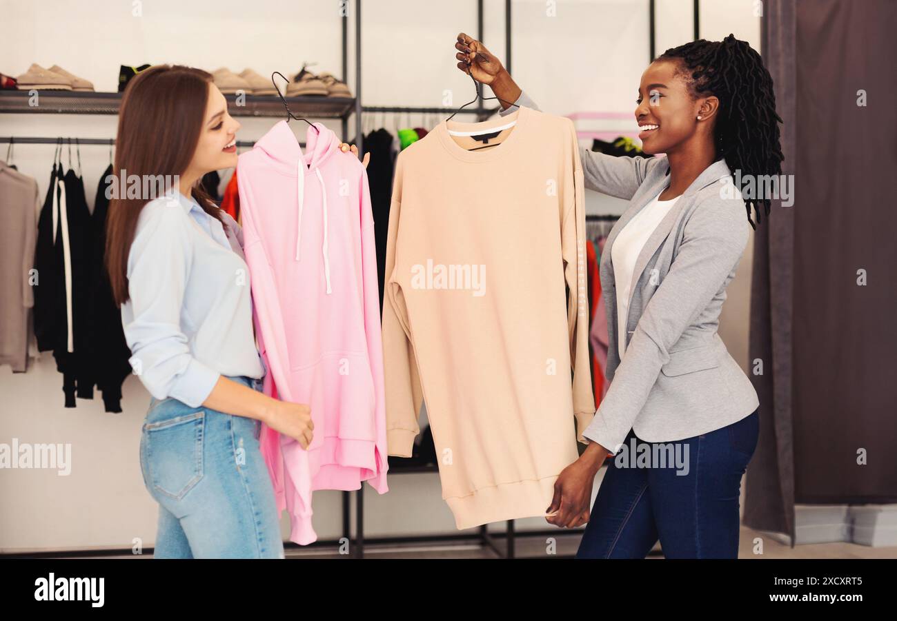 Two women in shirts hi-res stock photography and images - Alamy