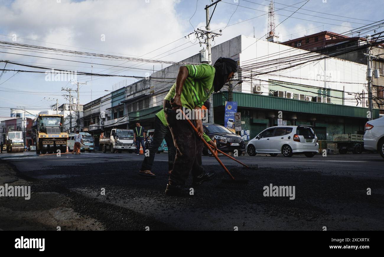 Men paving road hi-res stock photography and images - Alamy