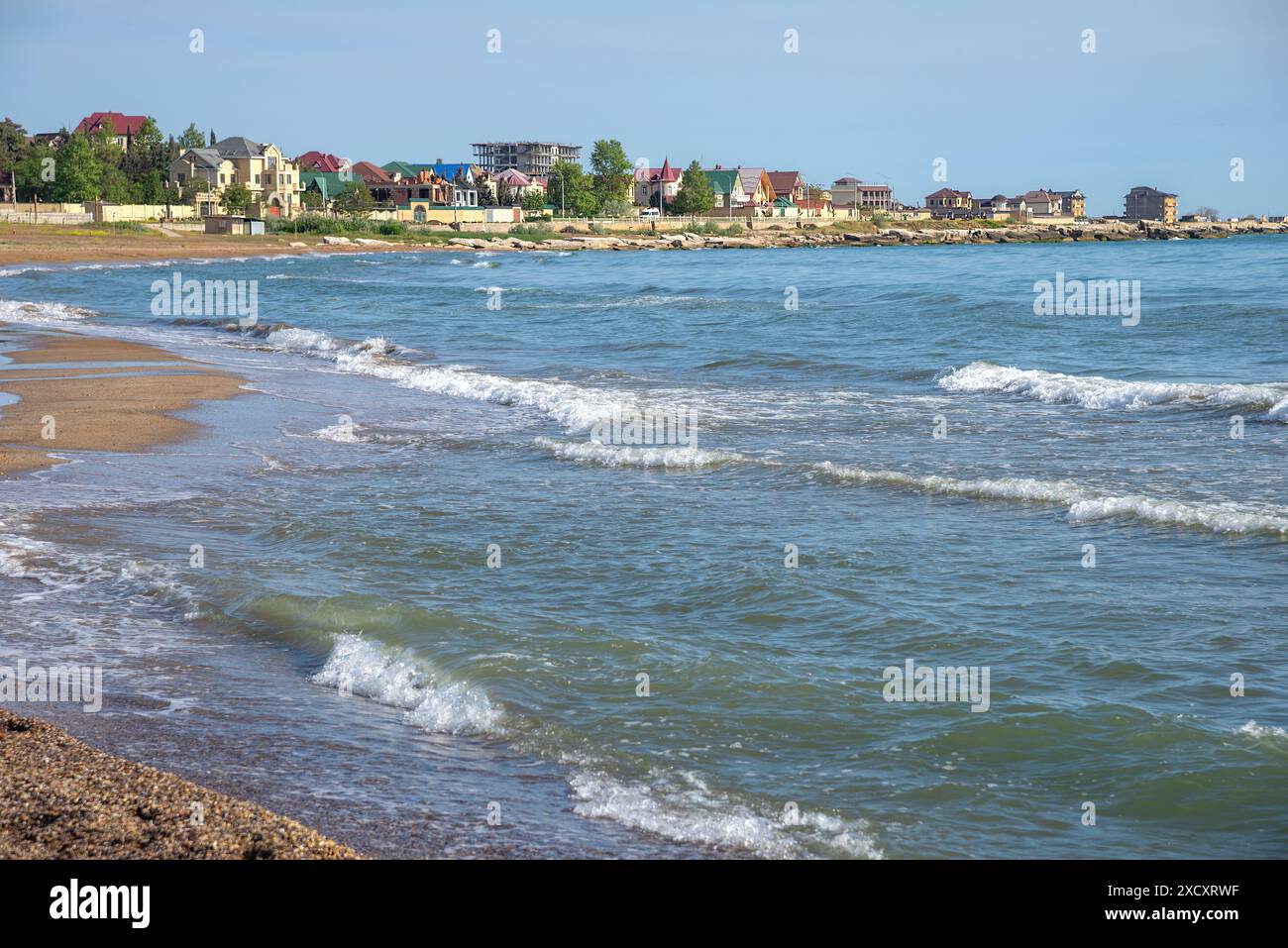 The coast of the Caspian Sea. The beach of the city of Derbent ...