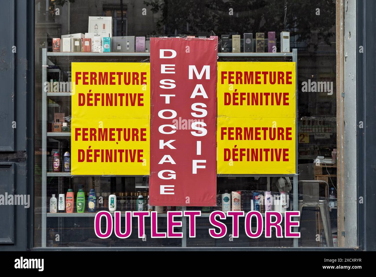 Store closing. Banner sign on a perfume shop window reading: “Permanent ...