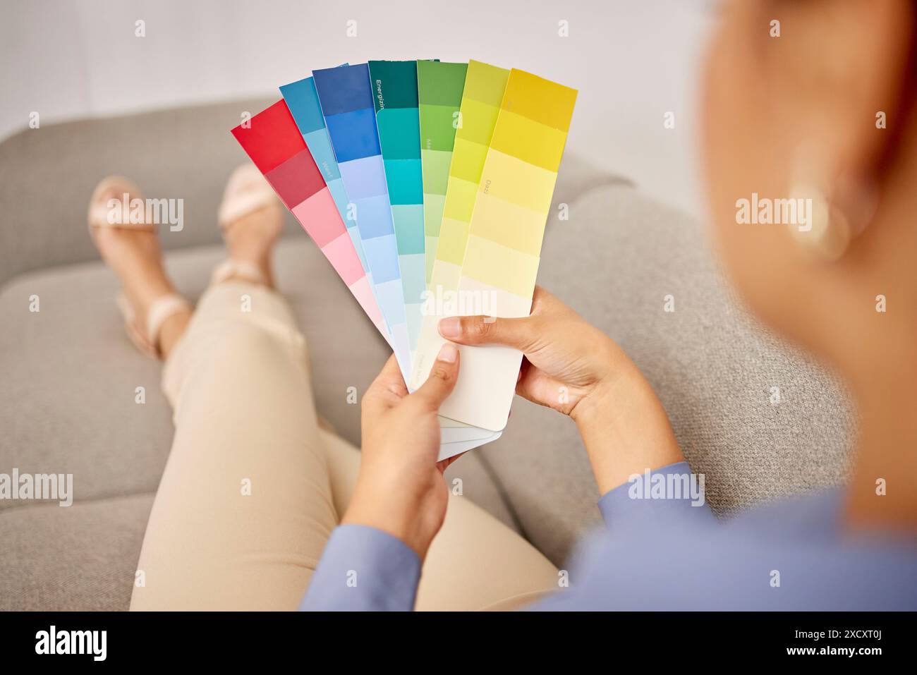 Woman, home and couch with color swatches for design project, sample ...
