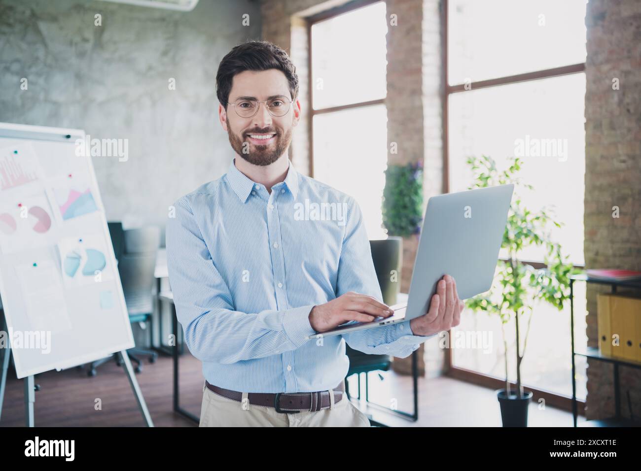 Photo of attractive young man netbook presentation dressed formalwear ...