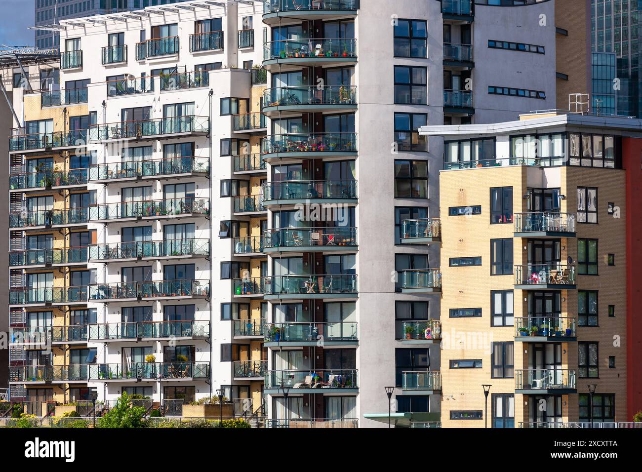 Balconies along River Thames bathed in sunlight. Residential apartment ...