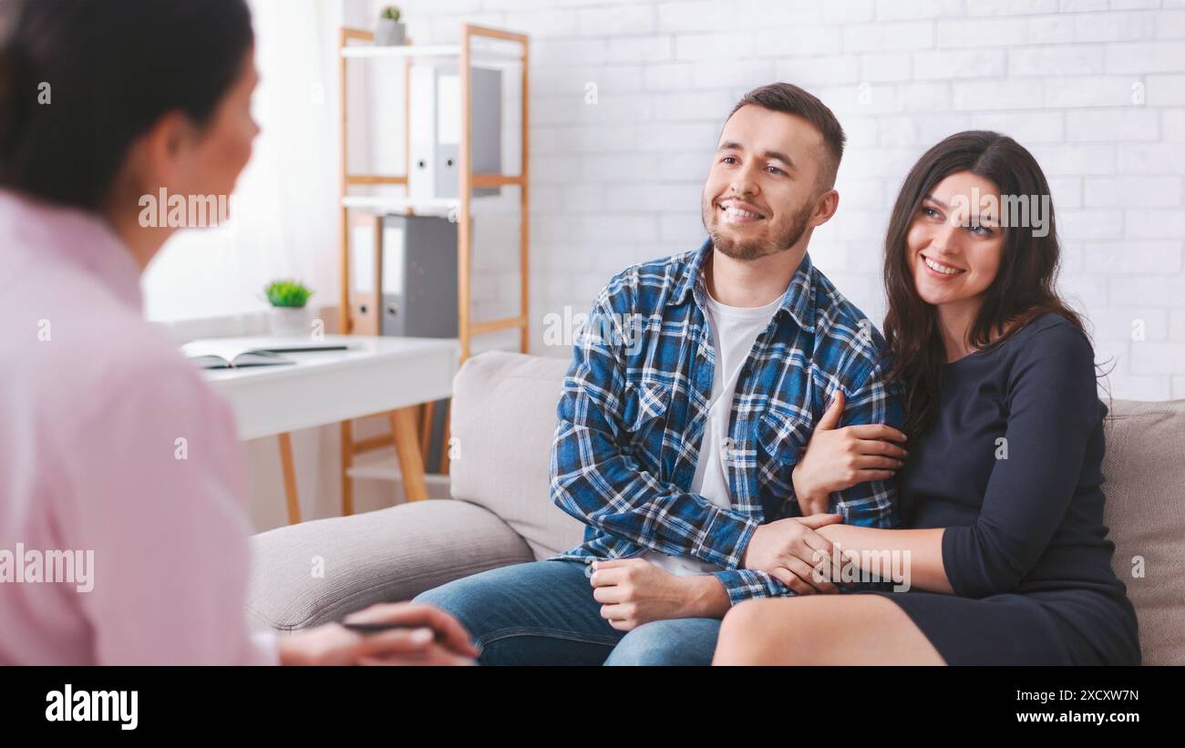Positive Couple Receiving Counseling From Therapist In Office Stock ...