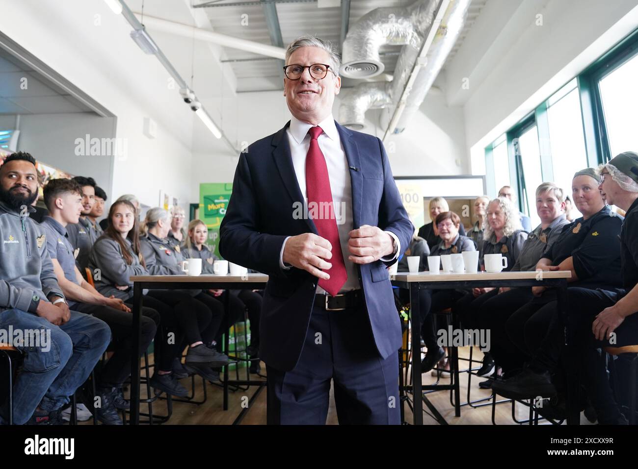 Labour Party leader Sir Keir Starmer (centre) , meets staff during a ...