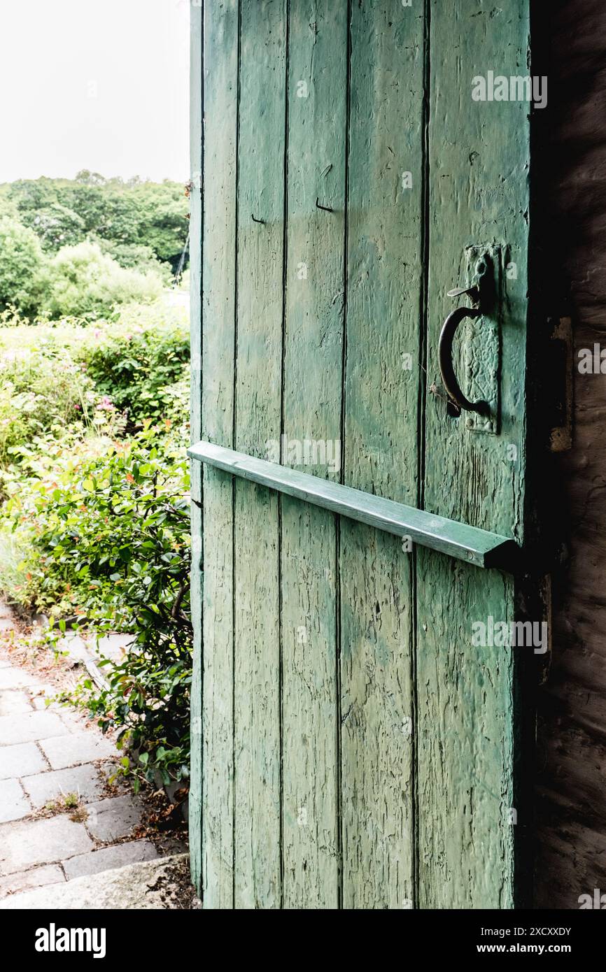 Old fashioned green dooor looking out into a kitchen garden Stock Photo ...